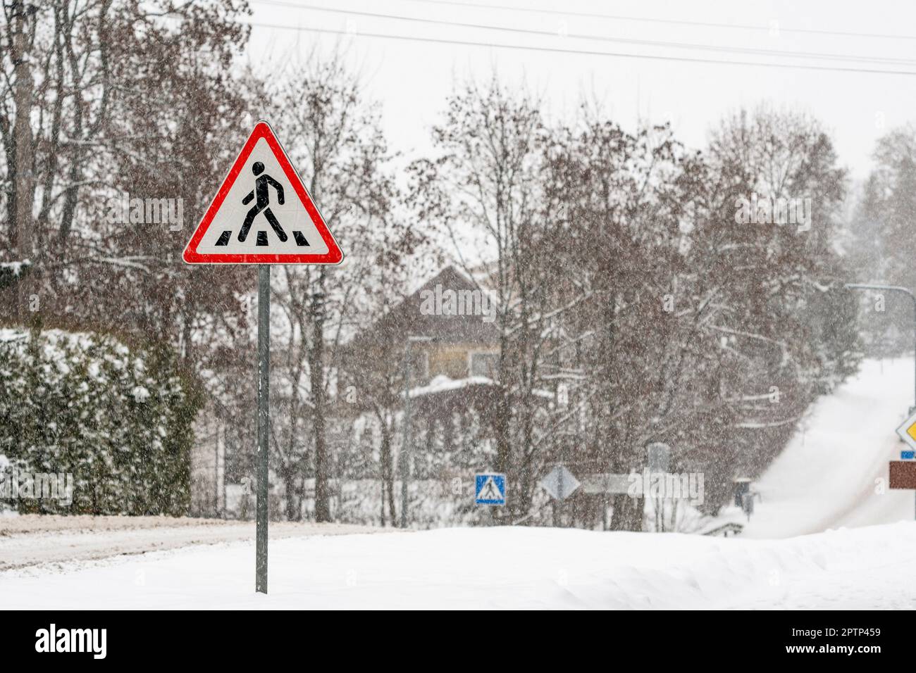 Pedestrian crossing traffic sign in a heavy snow storm Stock Photo - Alamy