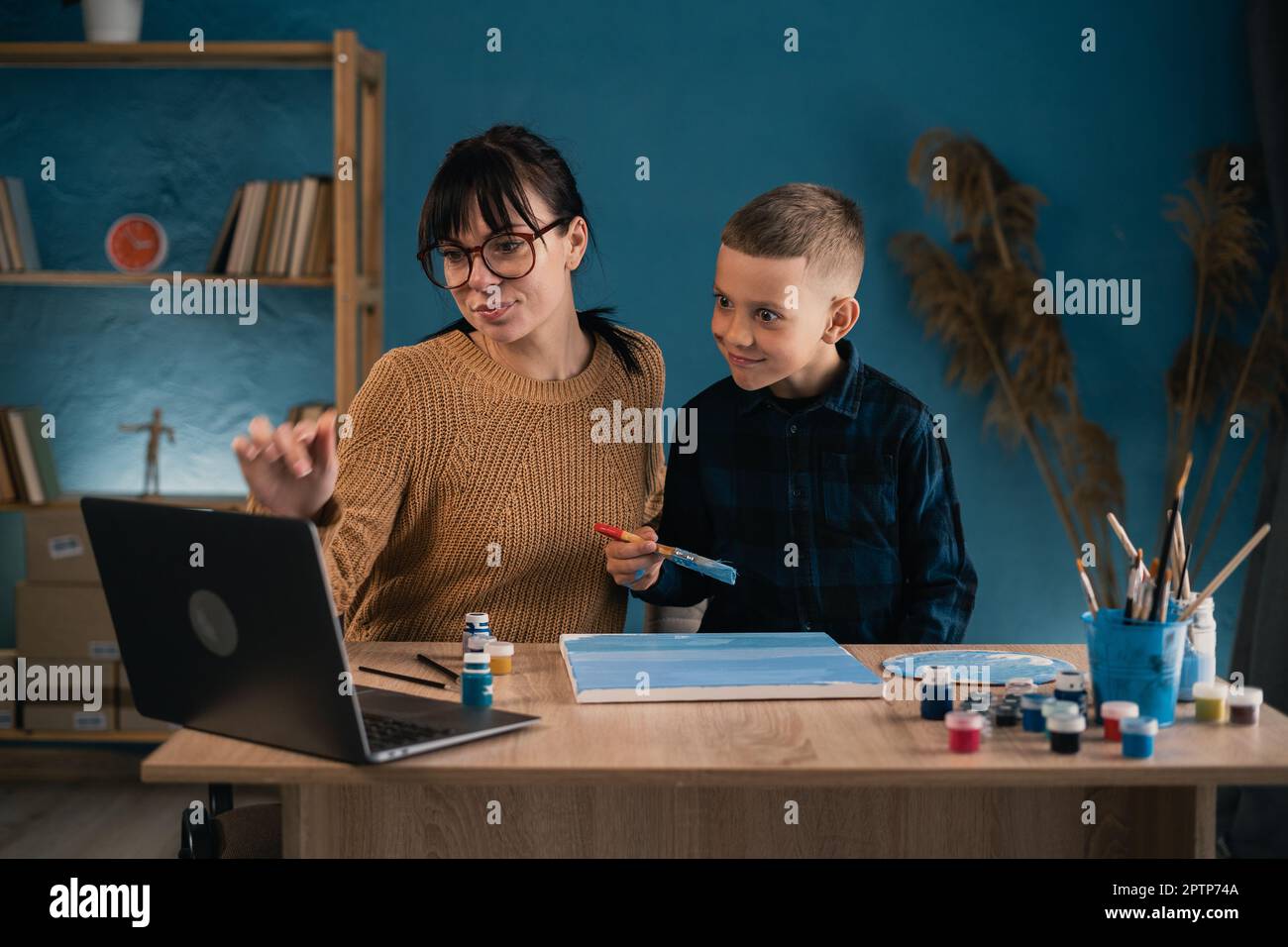 Smart schoolboy using drawing hi-res stock photography and images - Alamy