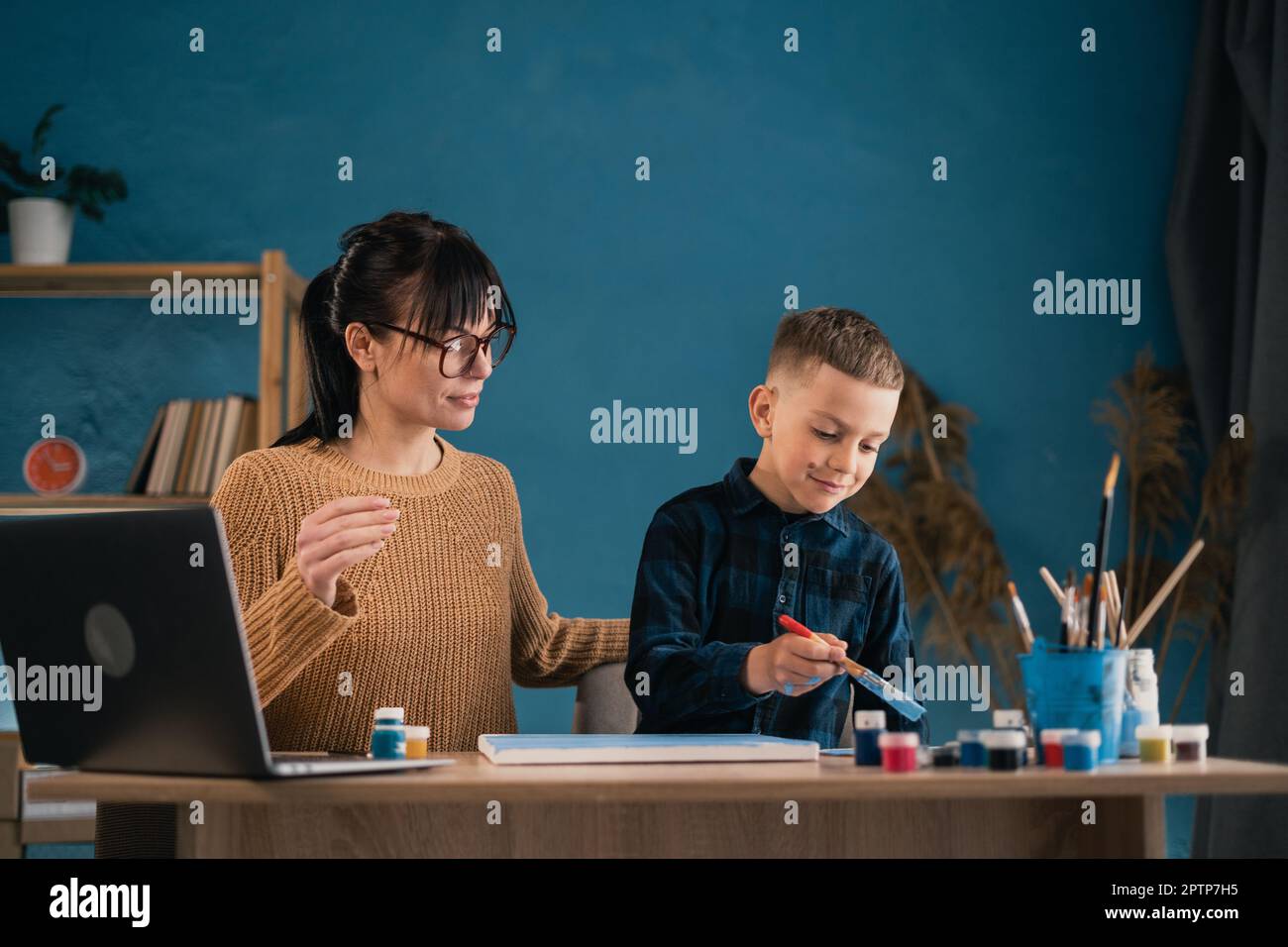 Smart schoolboy using drawing hi-res stock photography and images - Alamy