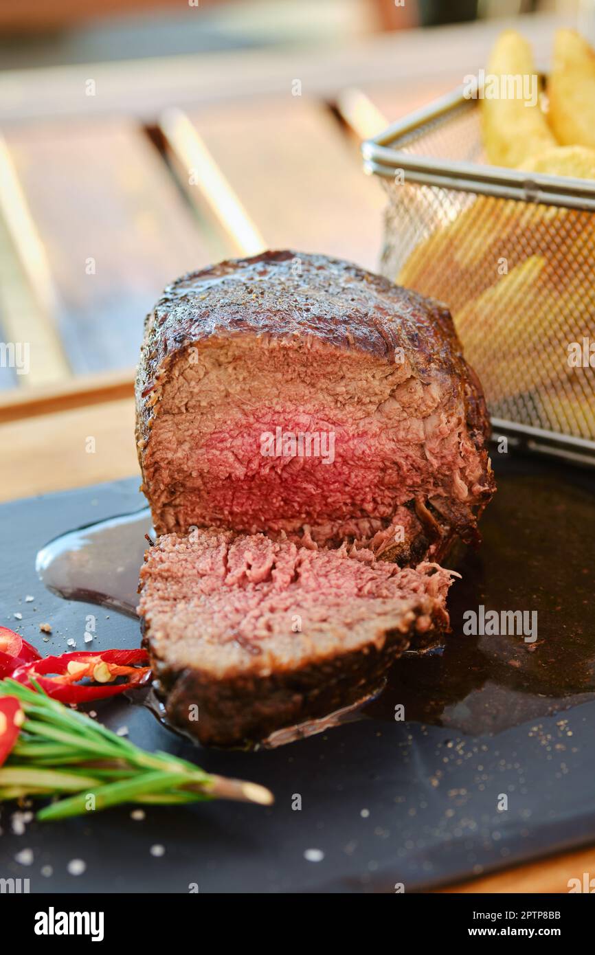 Grilled big fillet mignon beef steak cut on half Stock Photo - Alamy