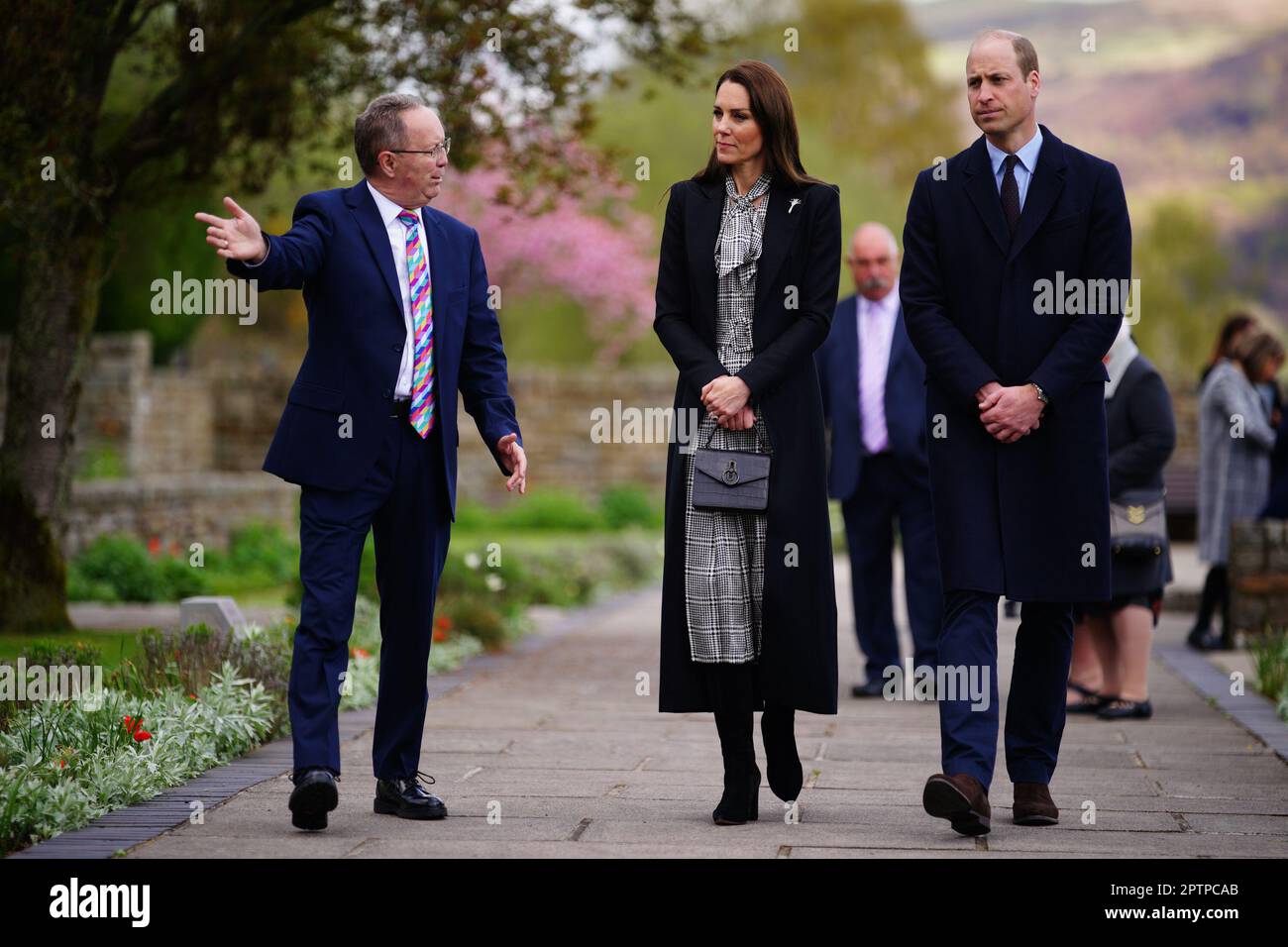 Aberfan disaster child survivor David Davies (left), walks with the ...