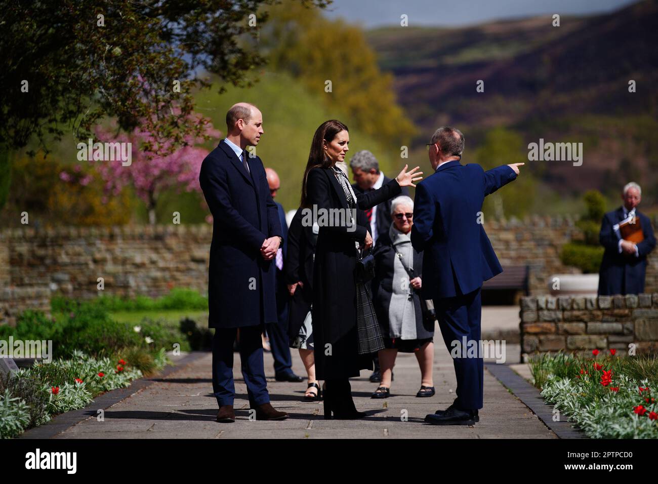 Aberfan disaster child survivor David Davies (right), walks with the ...