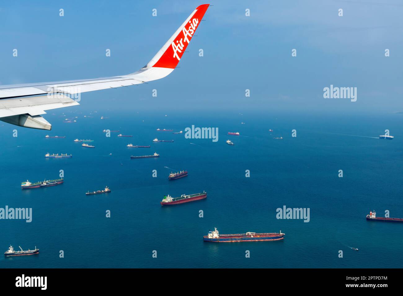 Aerial view of cargo ships queues to enter in Singapore harbor ...