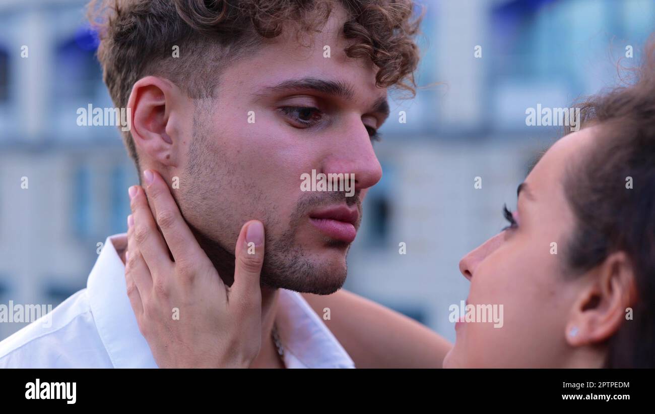 Close up of pretty woman touching man's face. Romantic date concept ...
