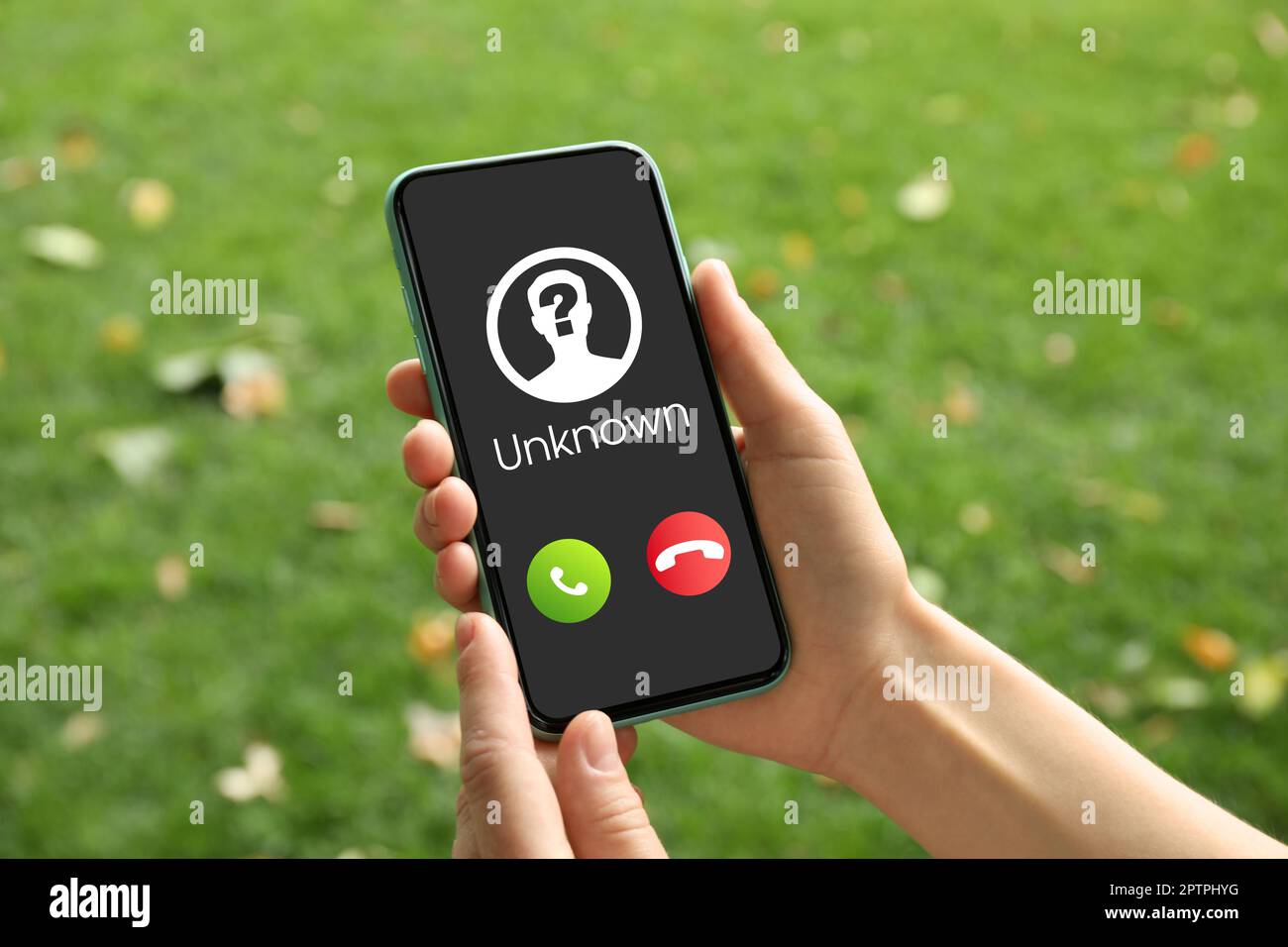 Woman holding smartphone with incoming call from unknown caller ...
