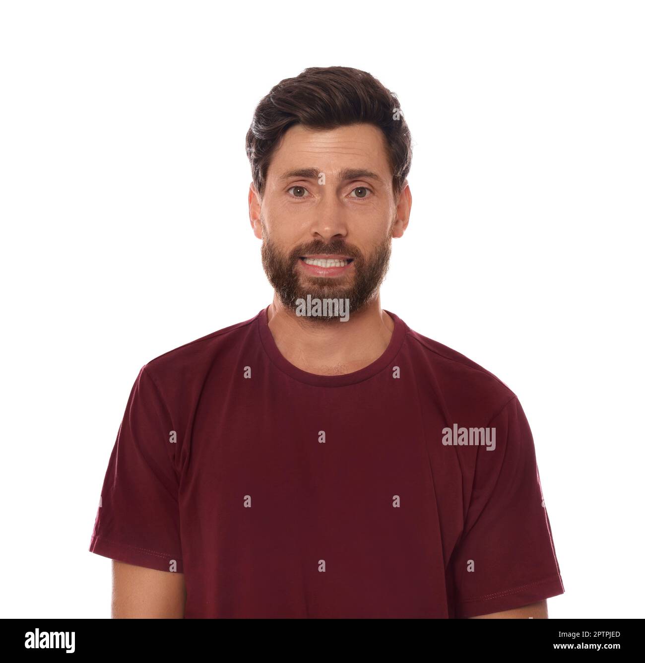 Embarrassed man in shirt on white background Stock Photo - Alamy