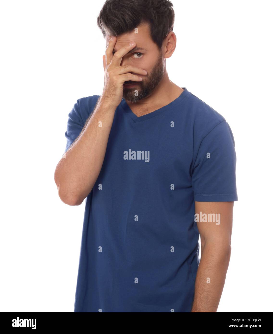 Embarrassed man covering face with hand on white background Stock Photo ...