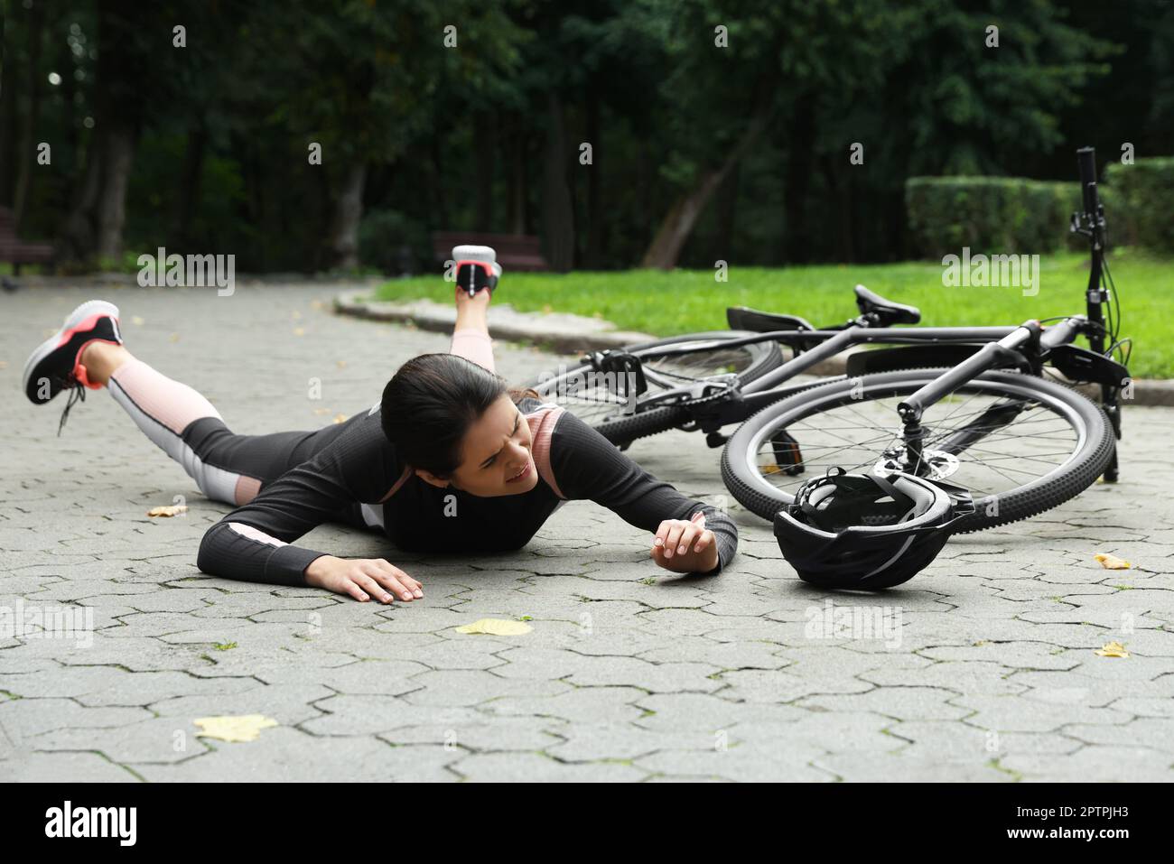 Woman fallen off her bicycle hi-res stock photography and images - Alamy