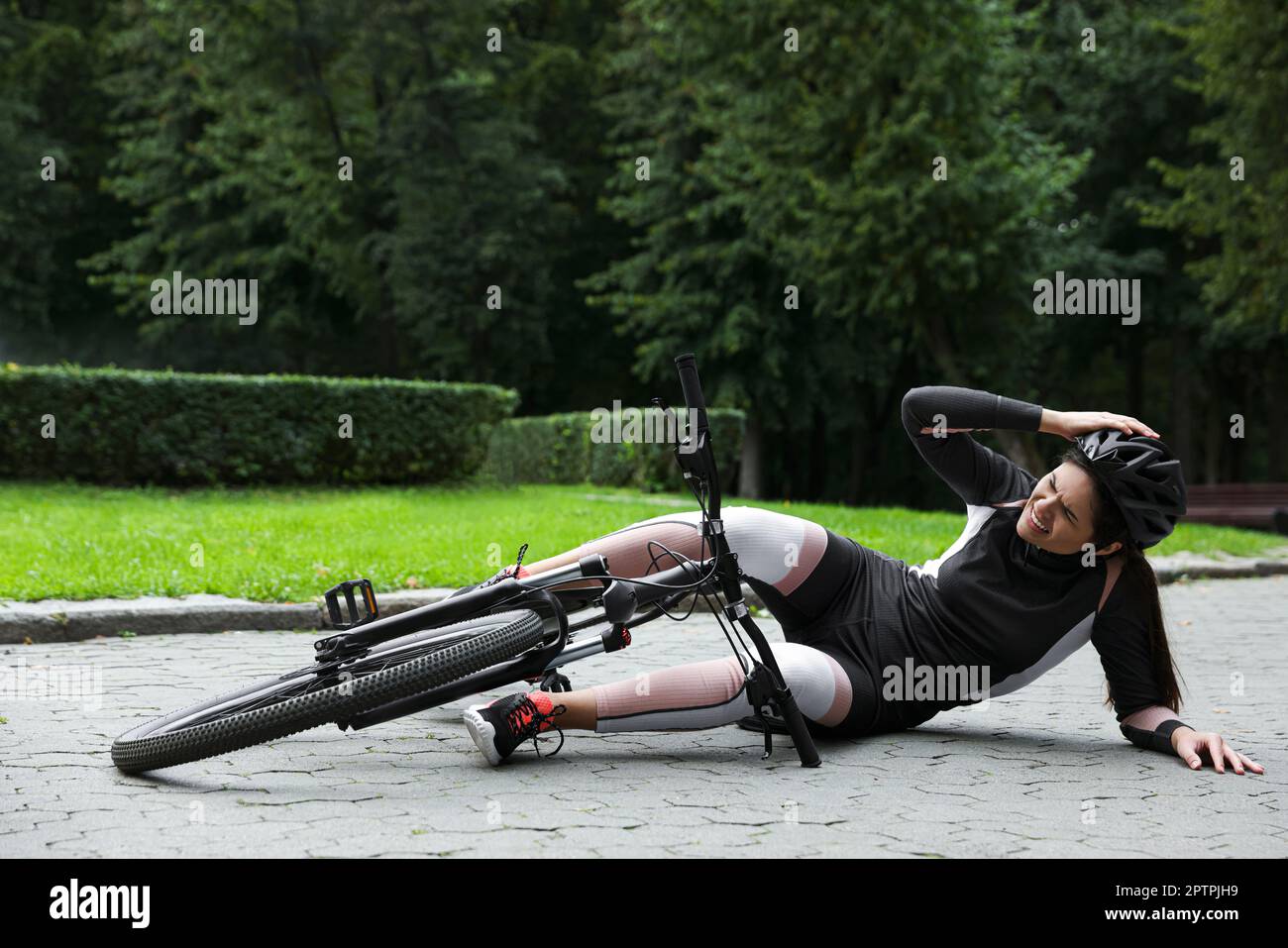 Woman fallen off her bicycle hi-res stock photography and images - Alamy