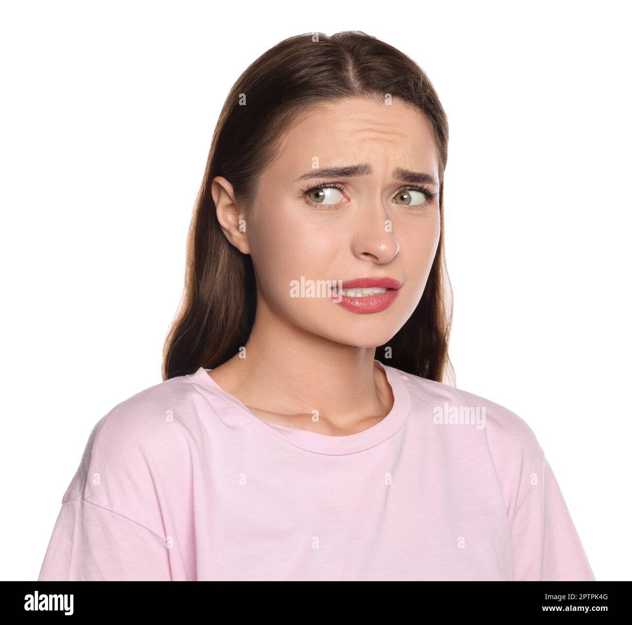 Embarrassed young woman in shirt on white background Stock Photo - Alamy