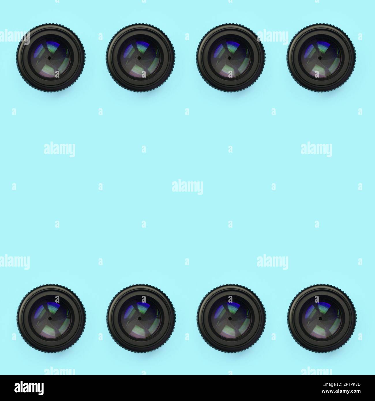 A few camera lenses with a closed aperture lie on texture background of ...