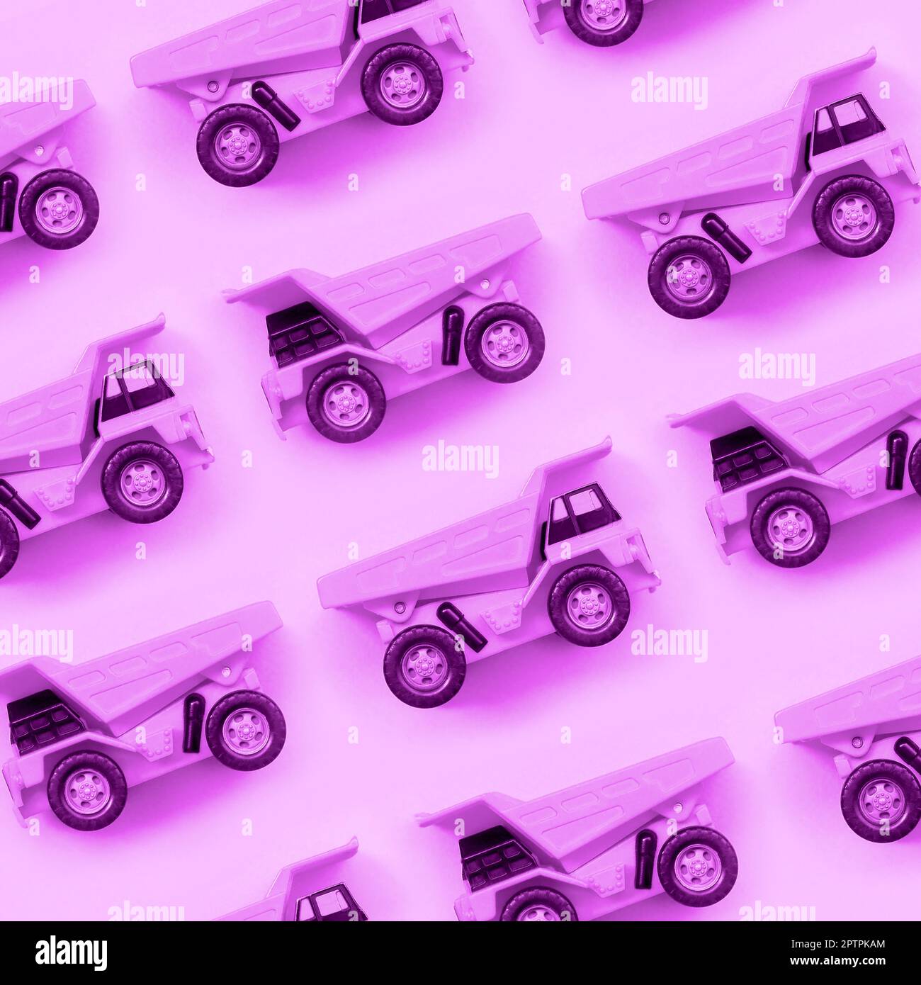 Many small purple toy trucks on texture background of fashion pastel ...