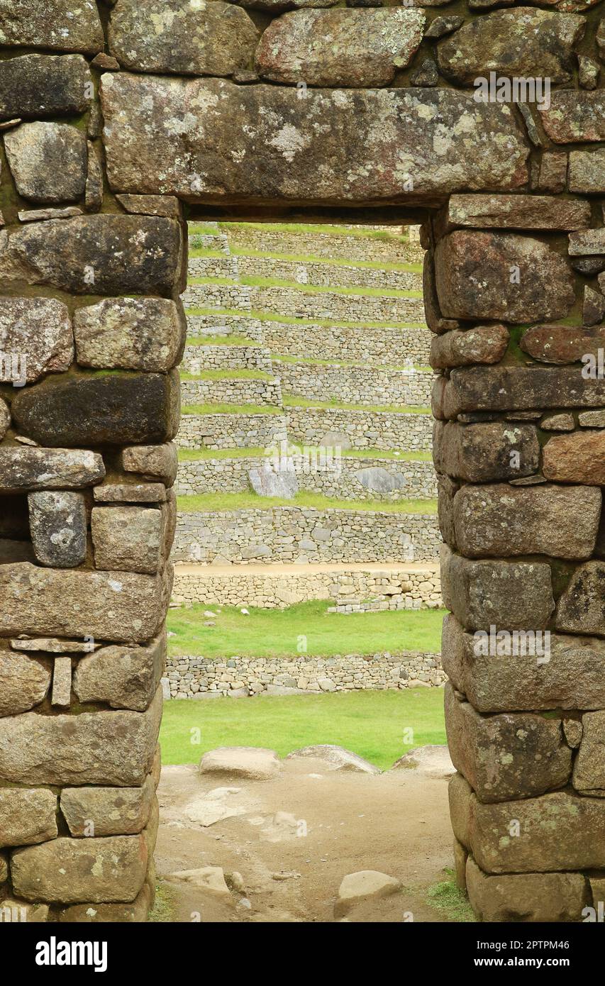 Ancient doorway with the remains of the Inca Ruins in Machu Picchu ...
