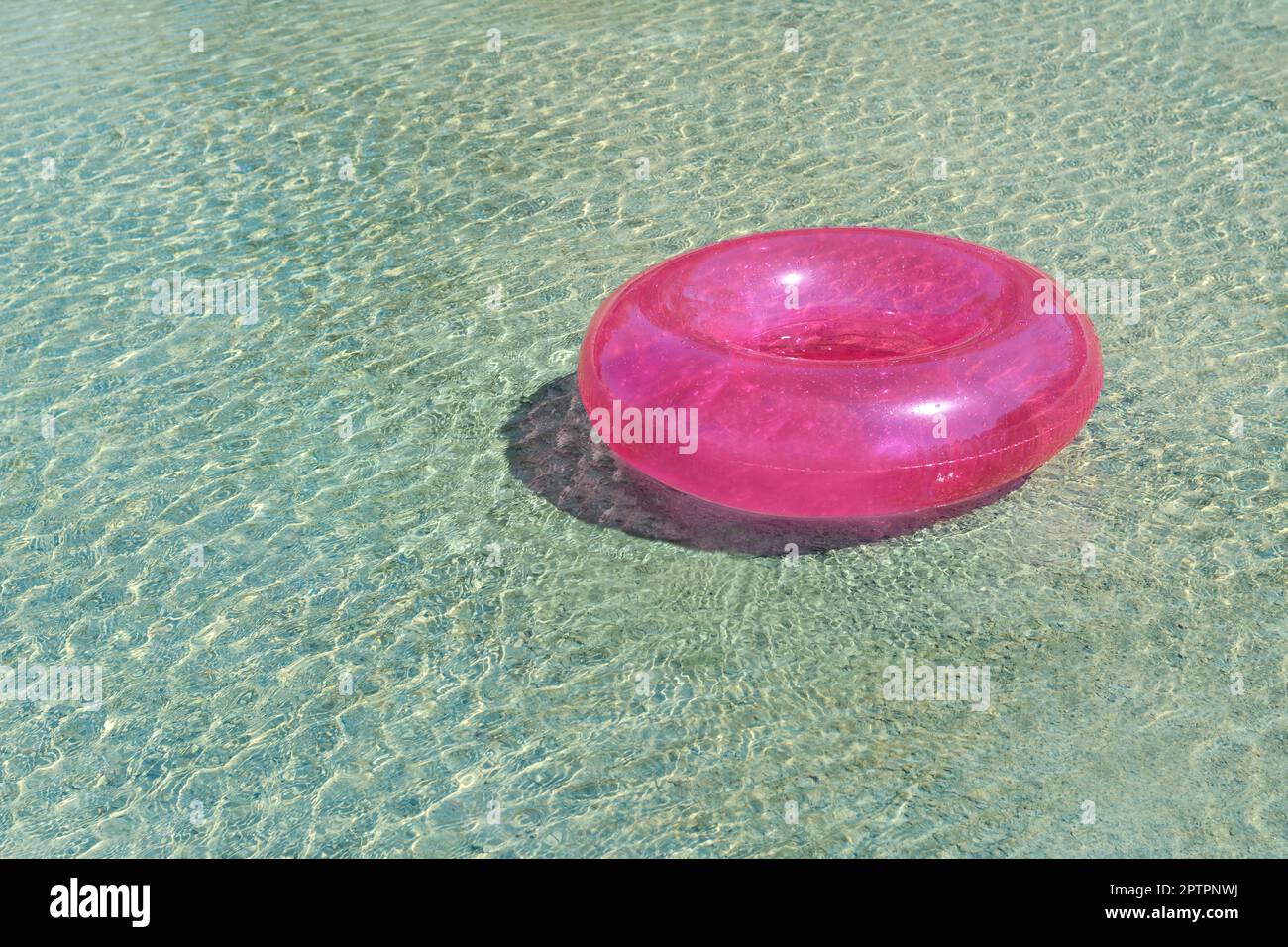 Bright inflatable ring floating on sea water. Space for text Stock ...