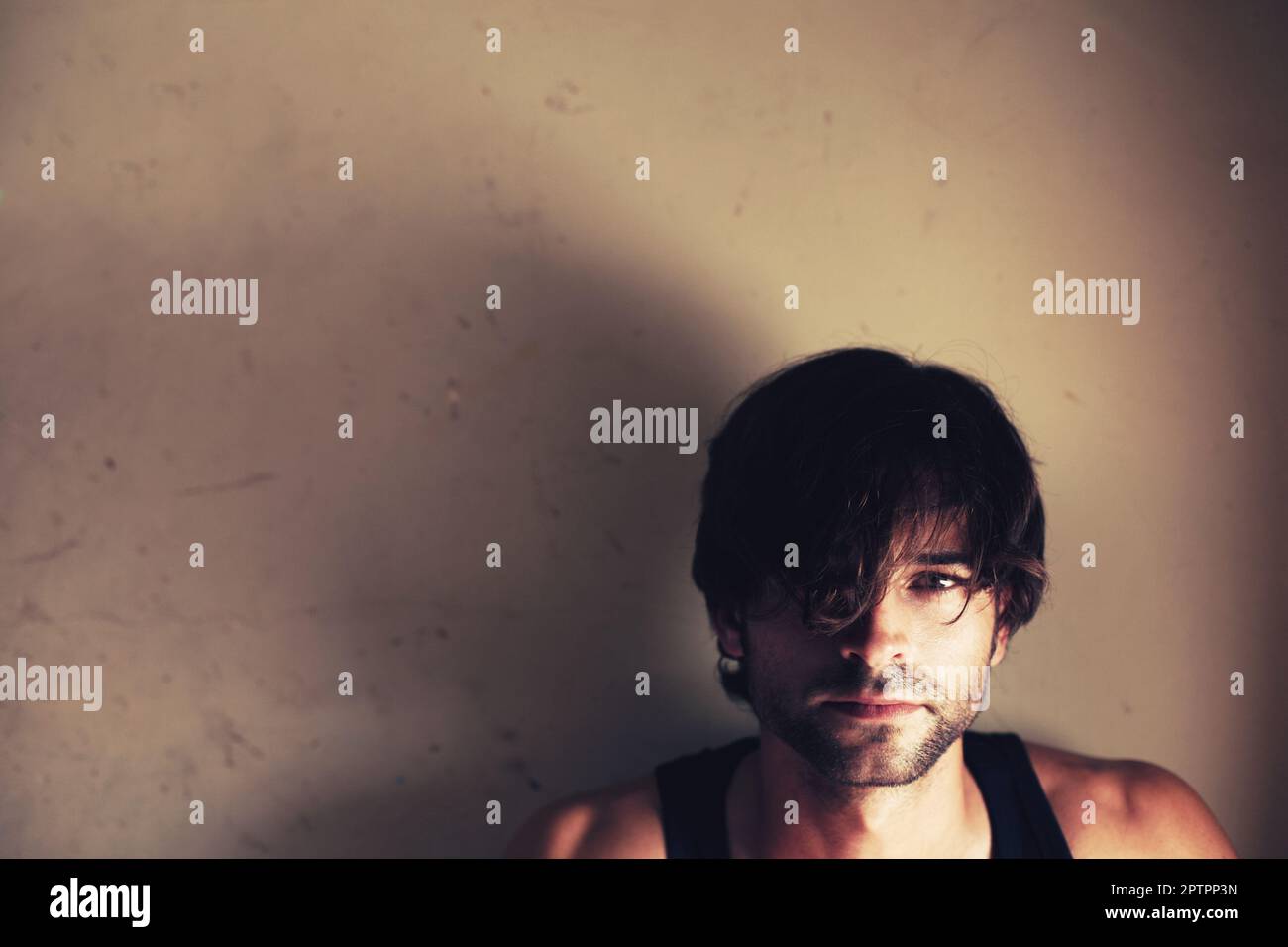He takes life as it comes. Young slightly disheveled young man pictured ...