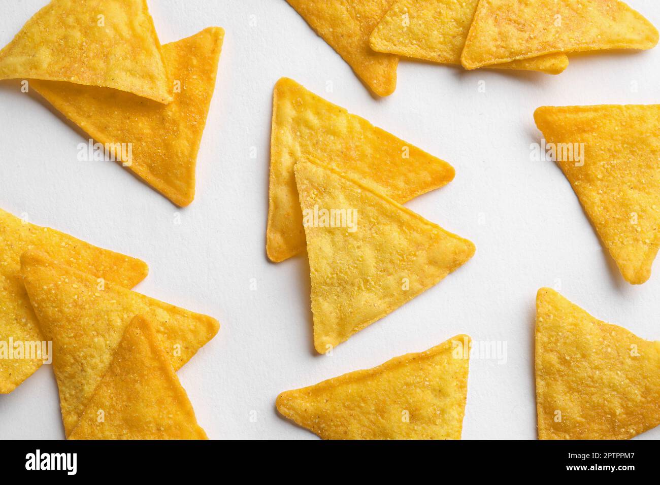 Flat lay composition of tortilla chips (nachos) on white background ...
