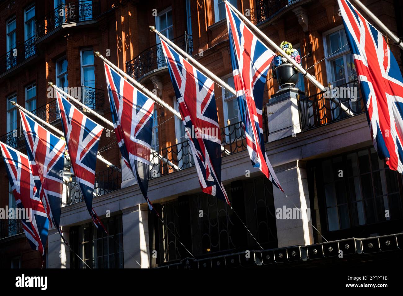 British flags in sunshine in central London Stock Photo - Alamy