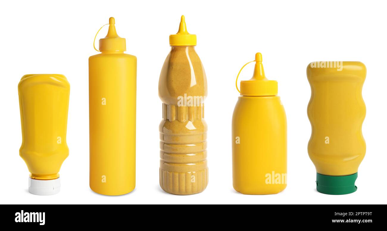 Set with different plastic bottles of spicy mustard on white background ...