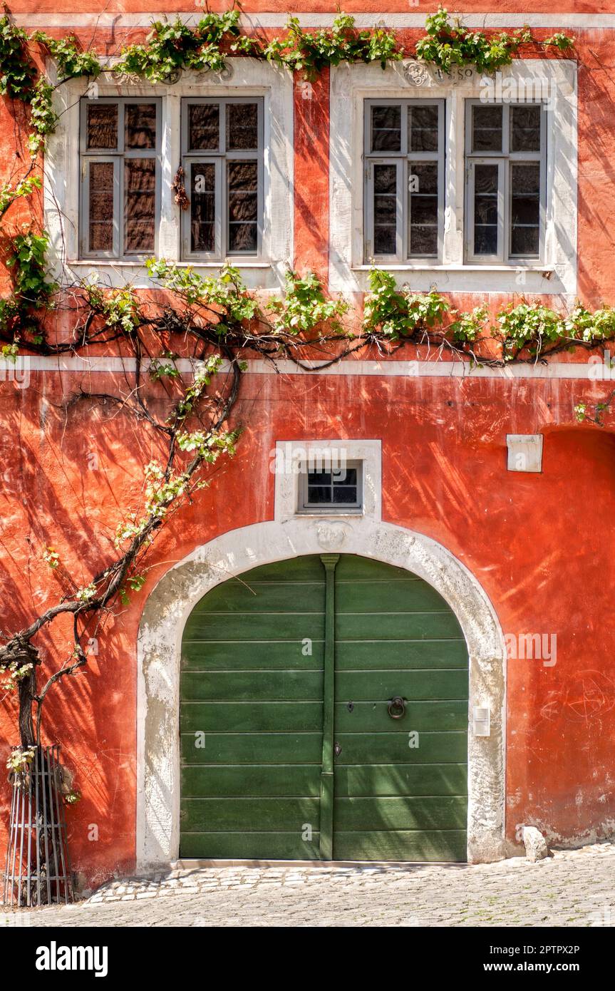 The facade of a residential house painted orange with closed entrance ...