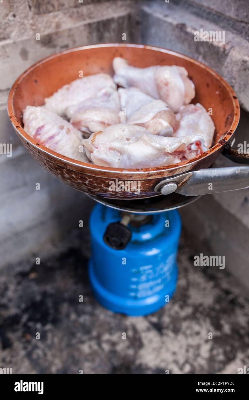 Frying chicken wings in portable hi-res stock photography and images ...