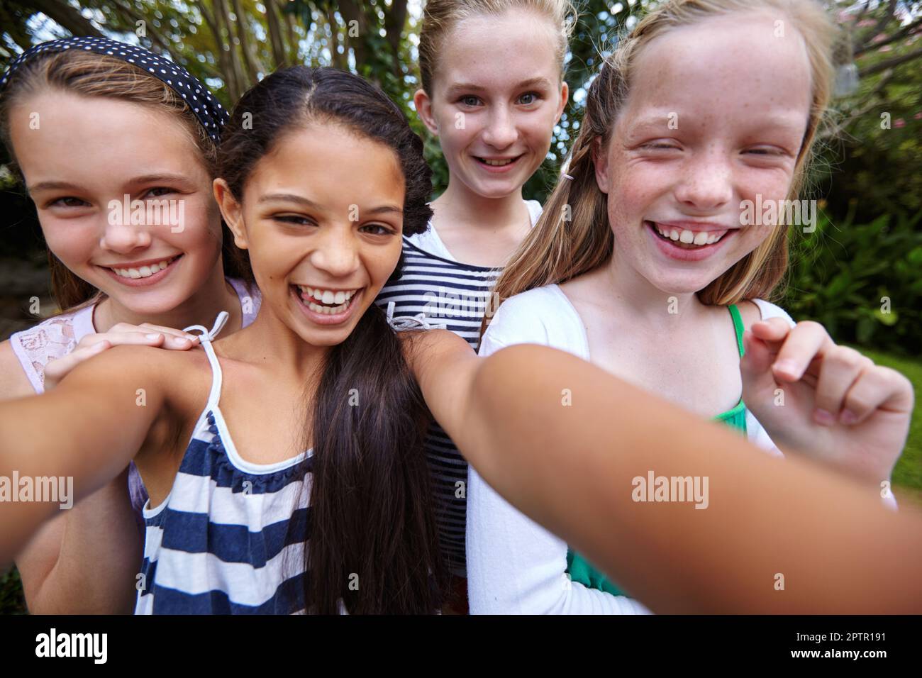 One...two...three...smile guys. a group of young girl friends taking a ...