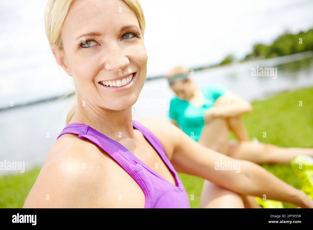 Our serene jogging location. Close up of a female athlete looking over ...