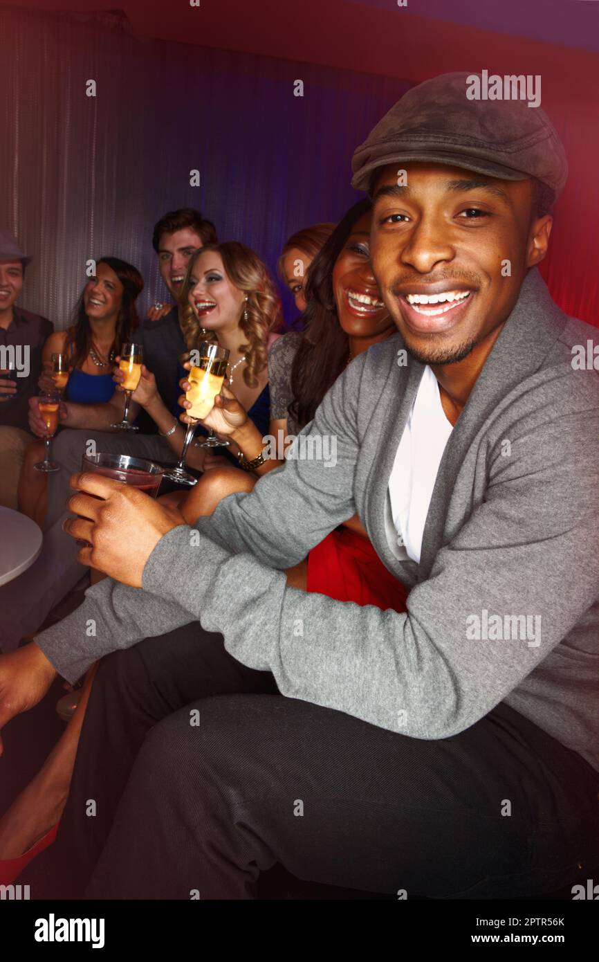 Night out on the town. A handsome african american man smiling happily ...