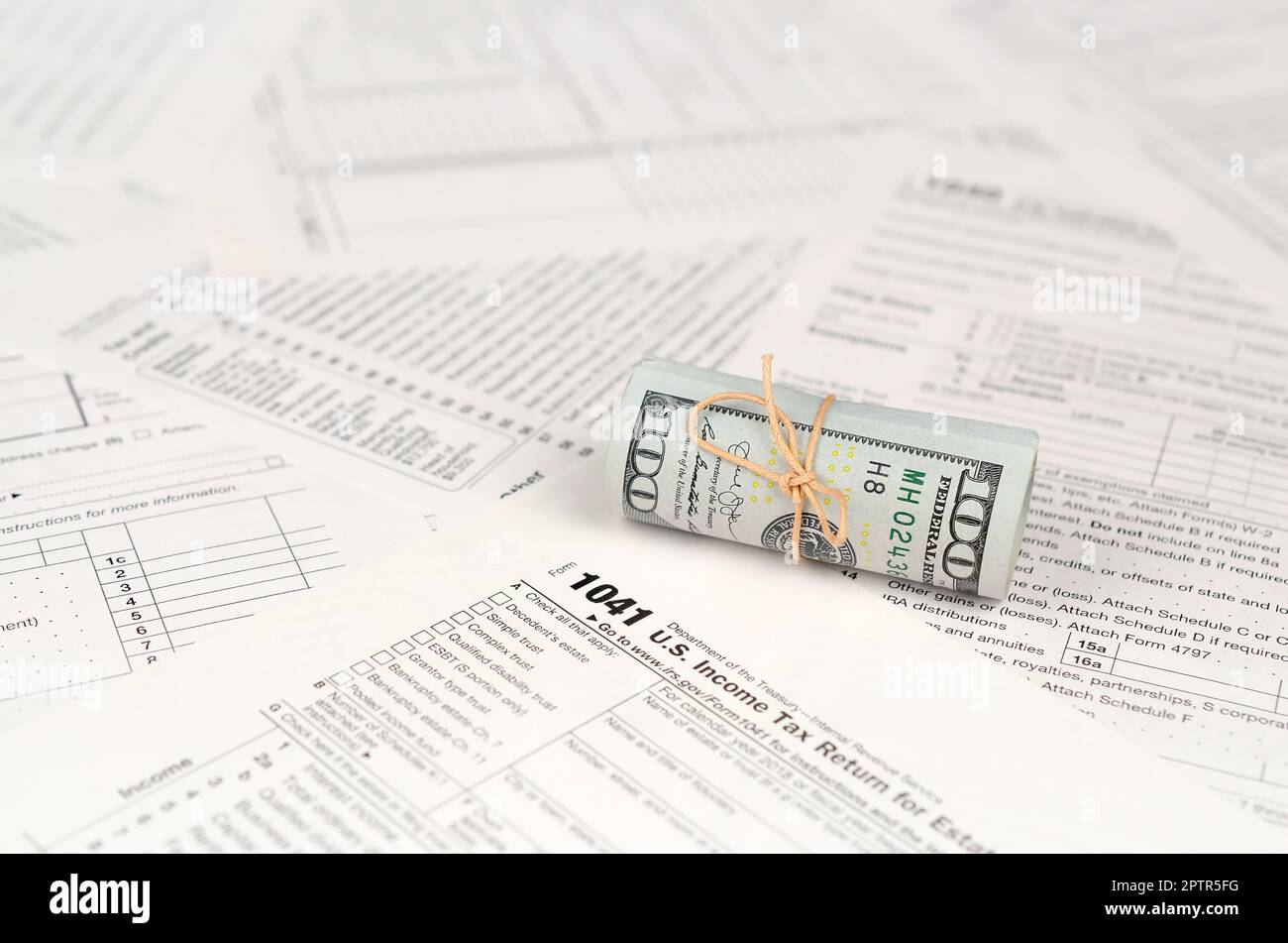 1041 U.S. Income tax return for Estates and Trusts form with roll of ...