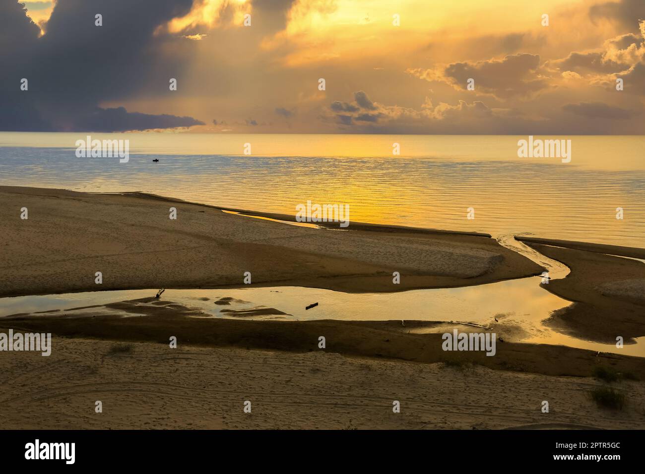 Autumn in Latvia, view of the Rigas bay and sandy beach with white ...