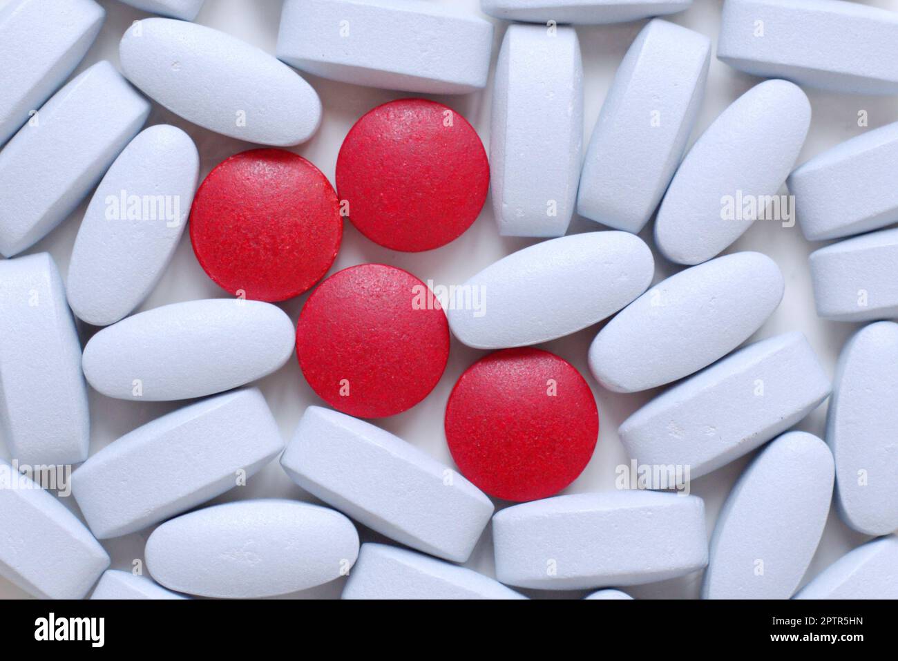 Pharmaceutical industry concept background. Red pills shown prominently ...