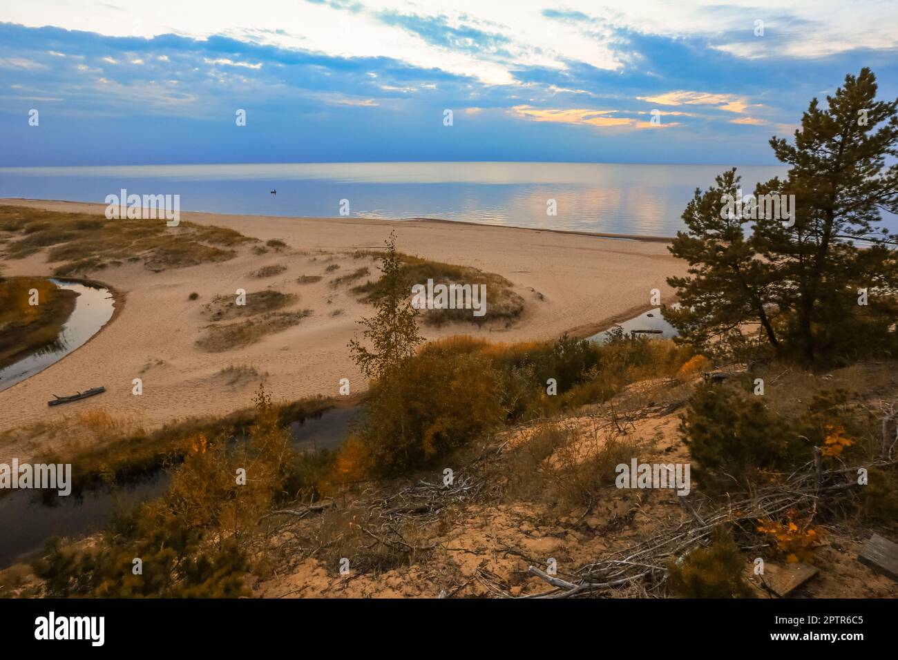 Autumn in Latvia, view of the Rigas bay sandy beach with white dunes in ...