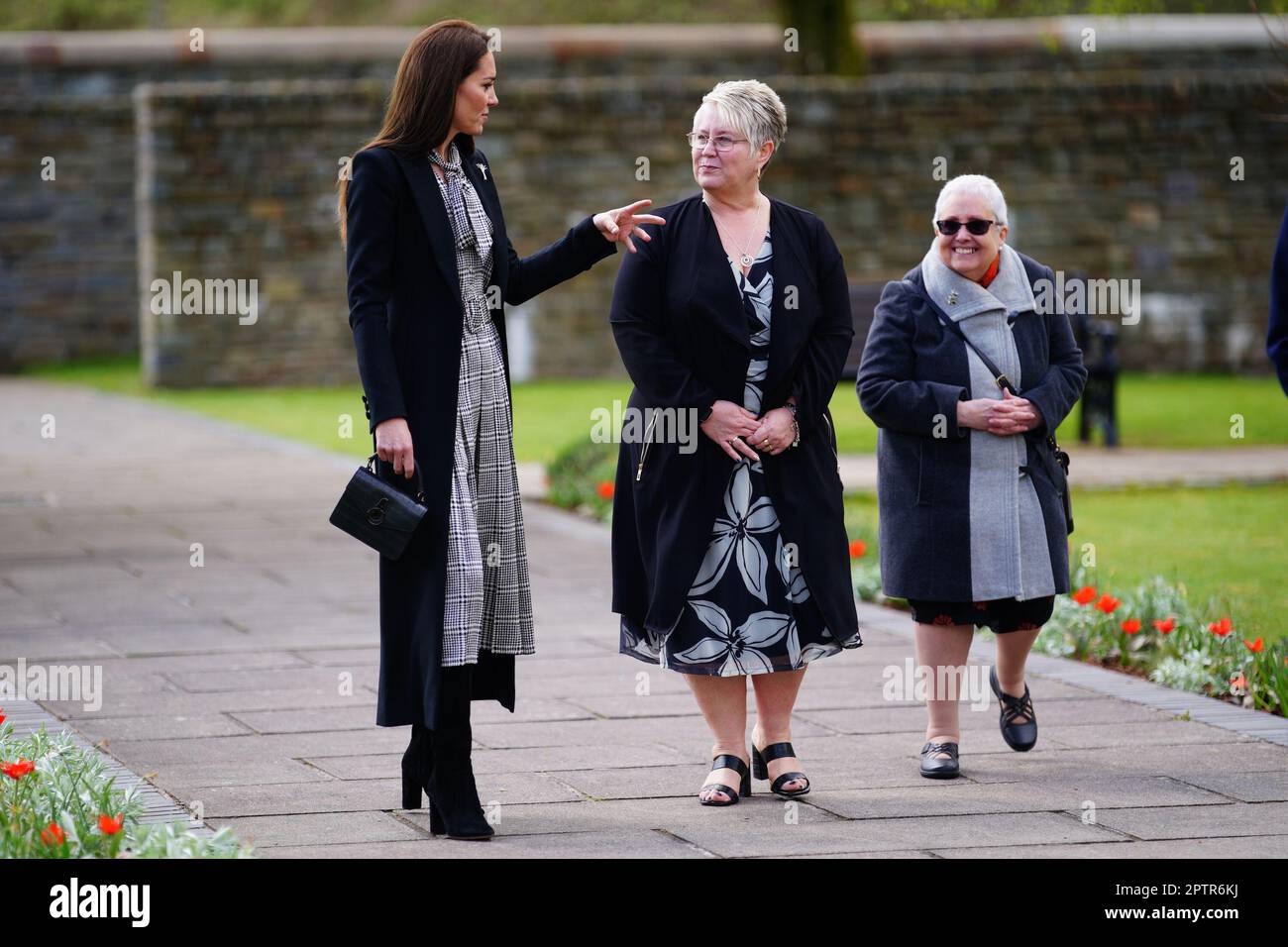 The Princess of Wales (left) walks with guests during her visit to the ...