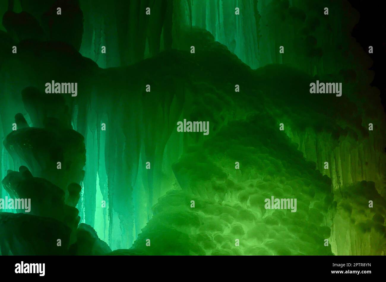 Huge ice icicles. Fragment of large blocks of ice frozen waterfall of ...