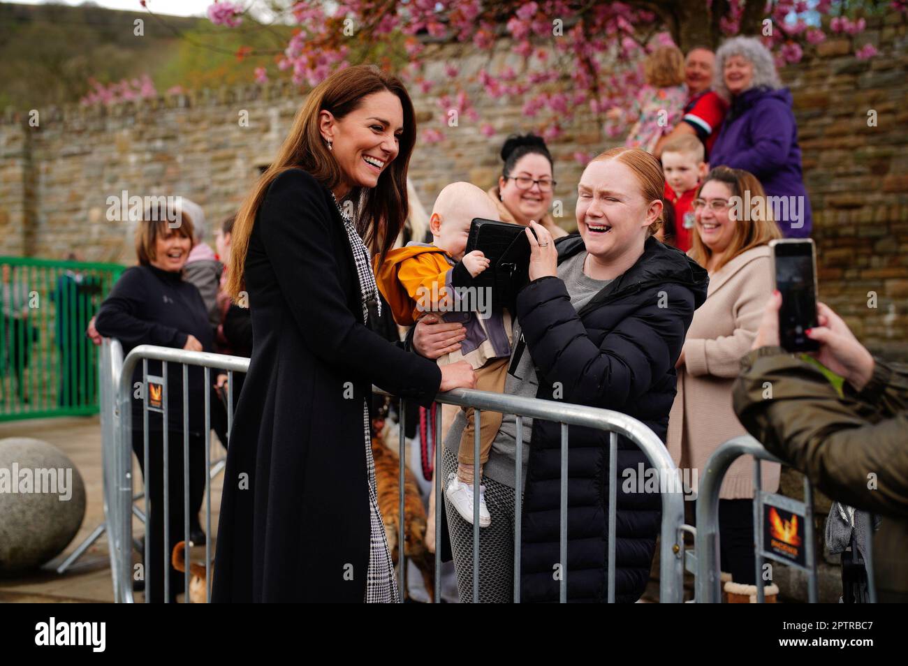 Lucy Williams, from Aberfan, holds her son Daniel as he takes the ...