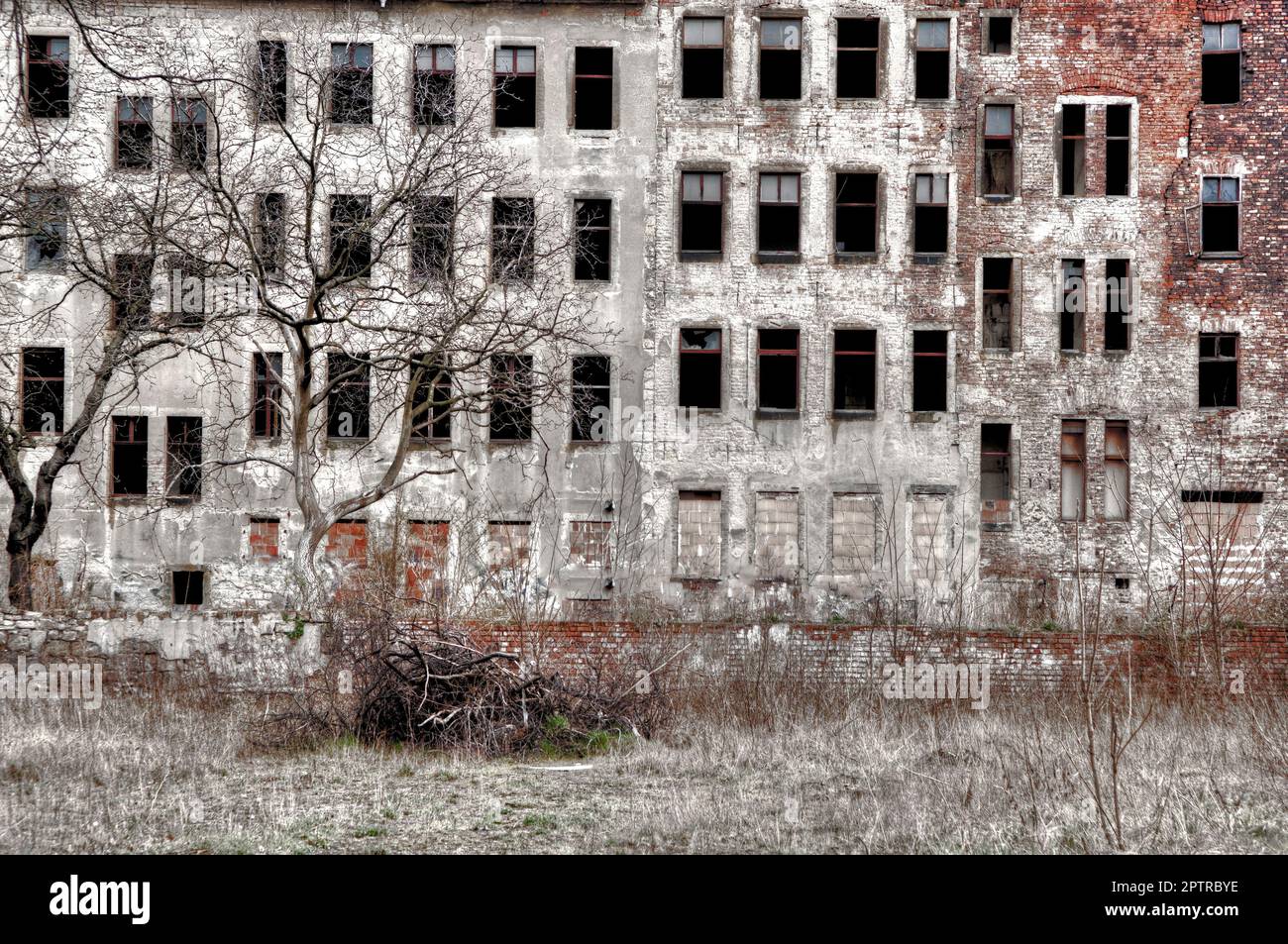 The dilapidated and ramshackle façade of a residential building ...