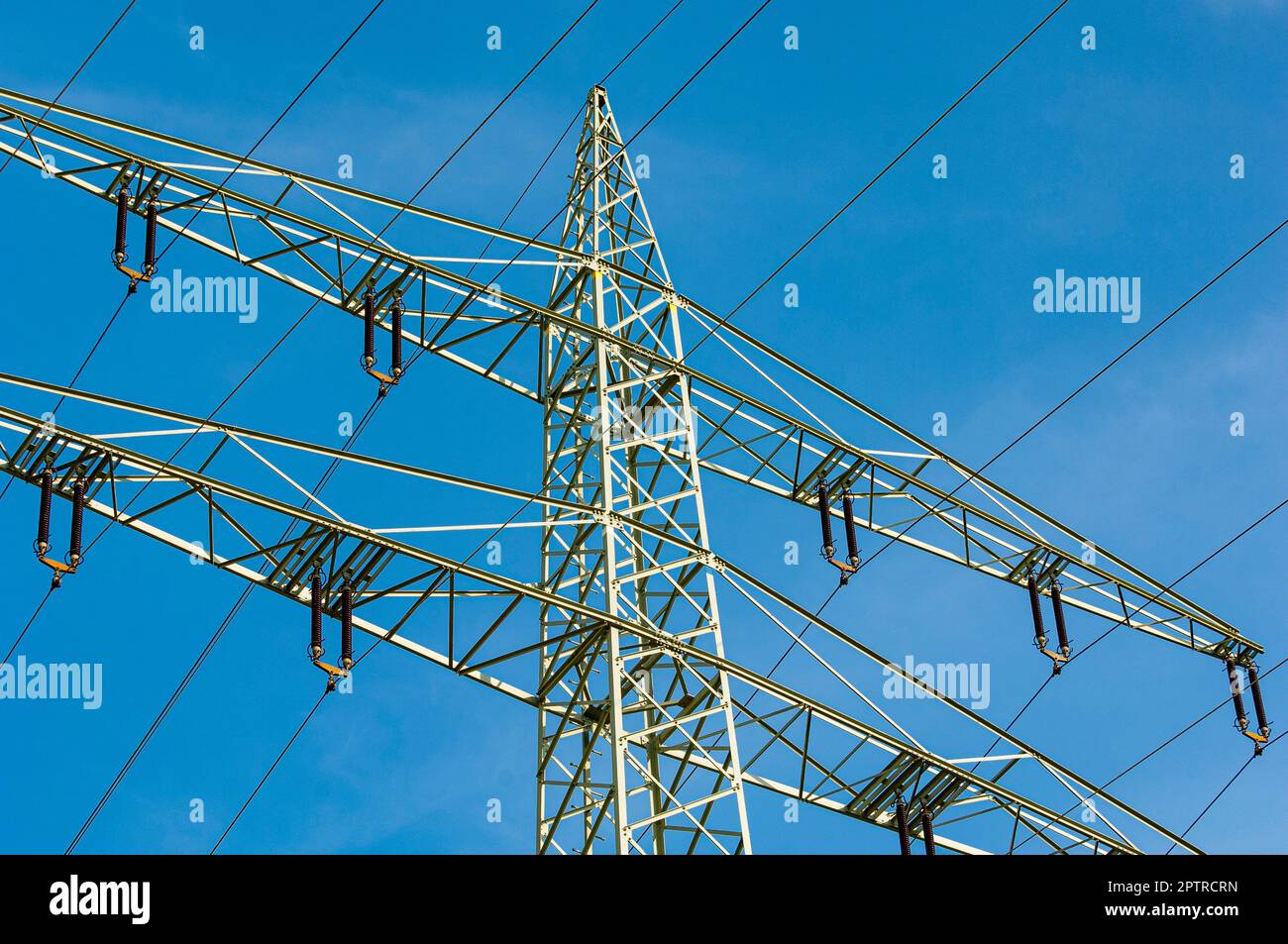 A power pole of an overhead line or power line with cables and ...