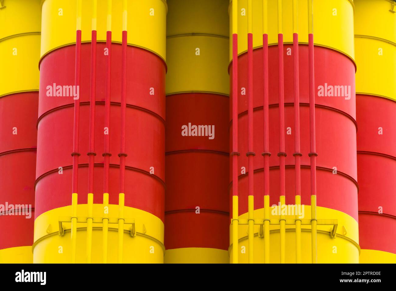 Detail view of silos in yellow and red colour Stock Photo - Alamy