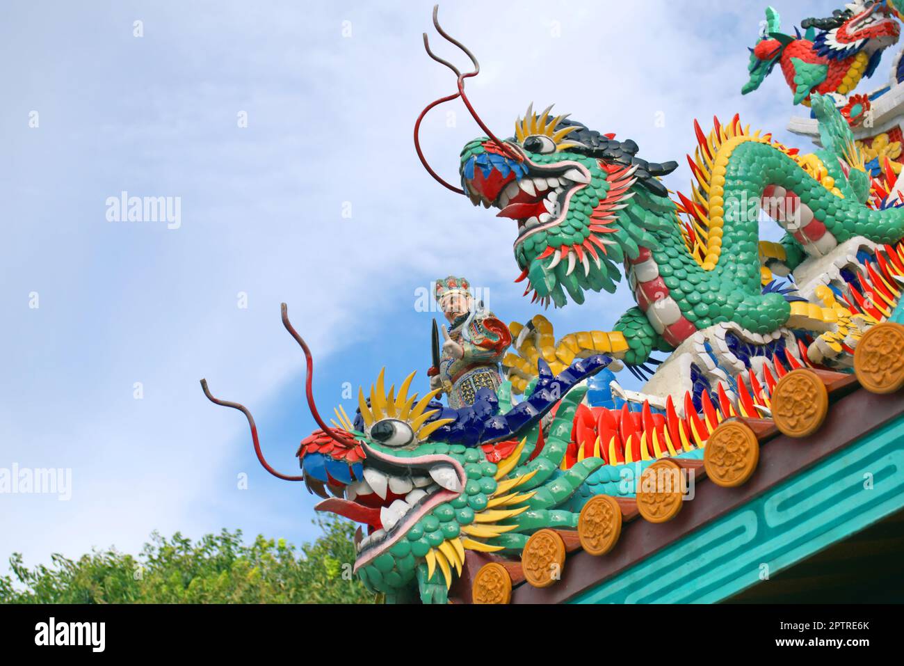 Dragons, ornaments and other religious symbols on a Chinese shrine in ...