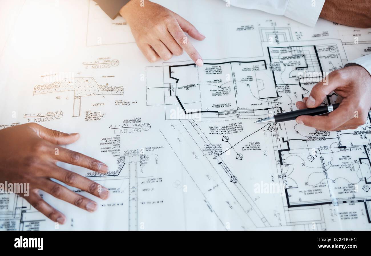 Hands of architects, engineers and building construction workers ...