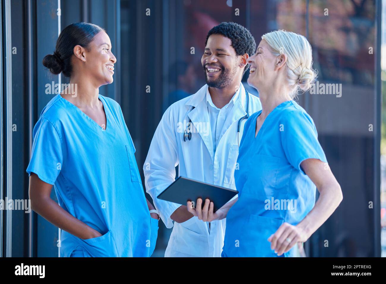 Diversity, teamwork and healthcare, a team of doctors talking and ...