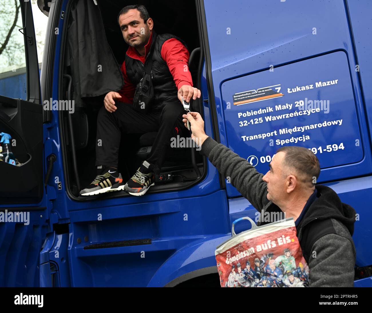 28 April 2023, Hesse, Gräfenhausen: An Eastern European truck driver ...