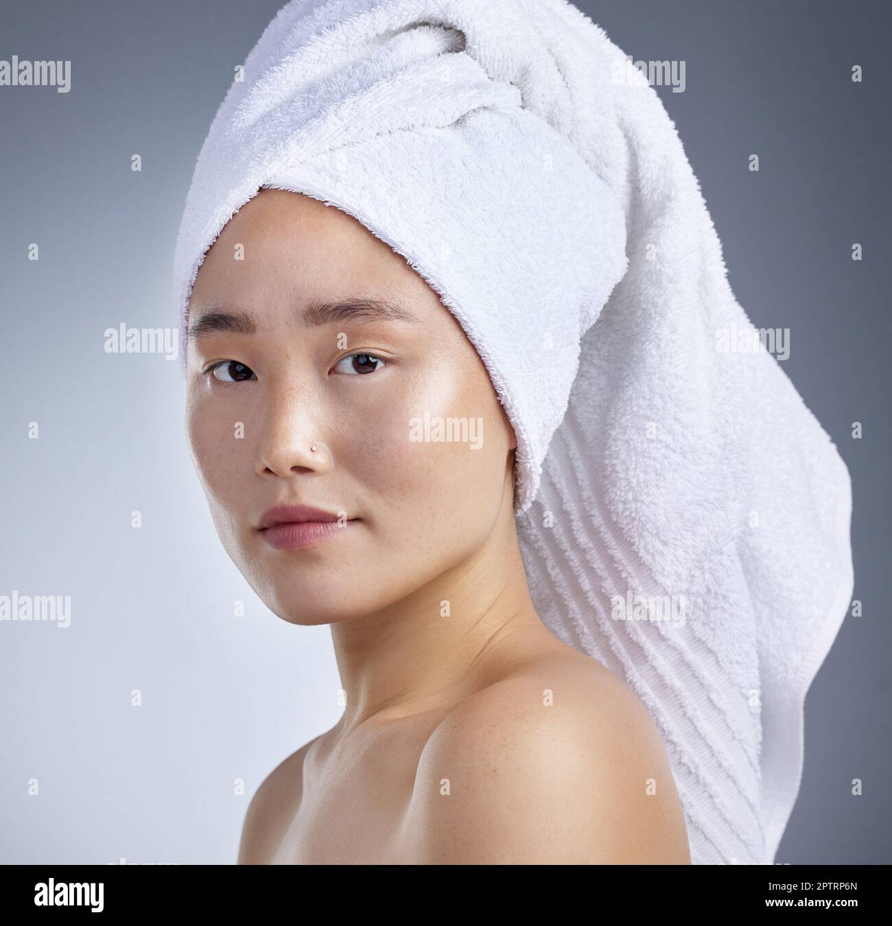 Straight Out The Shower A Young Woman Standing Against A Grey