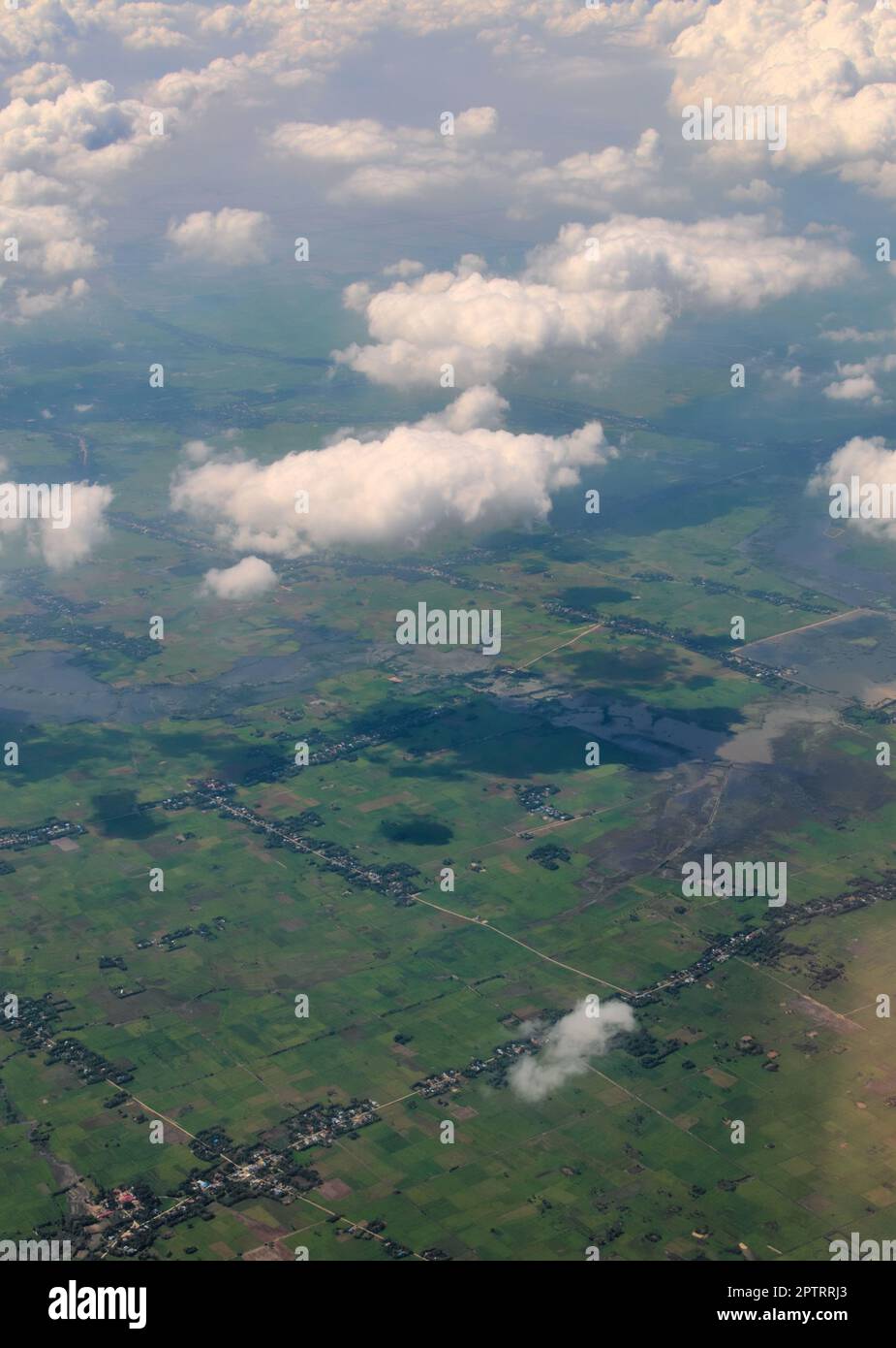 Cumulus clouds seen from above. Cloudscape at high altitude. Flying ...