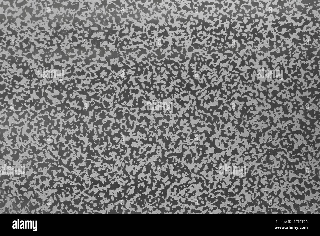 Mottled metallic corroded texture on an aluminum sheet, treated with ...