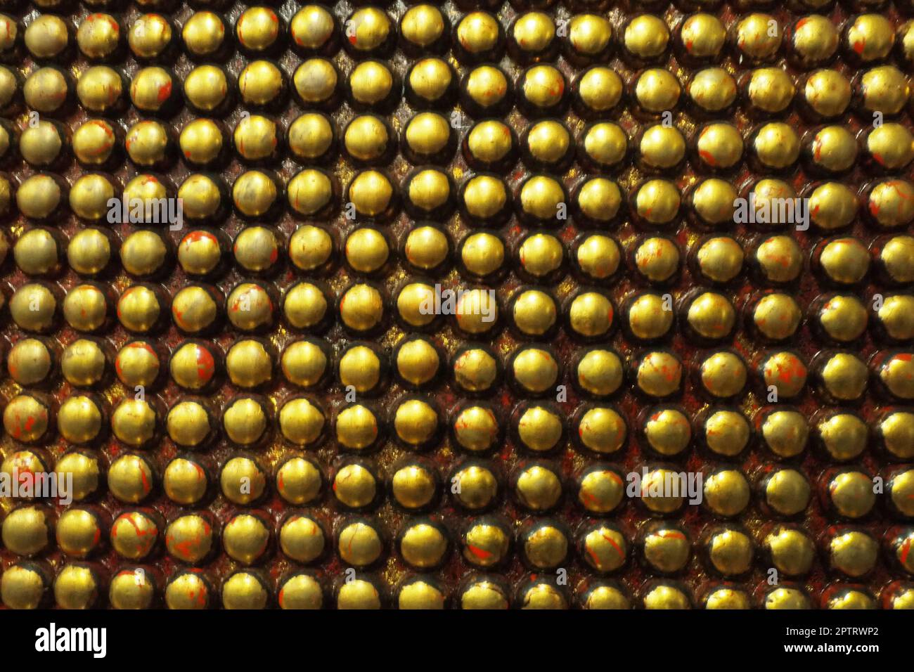 Pimples or spikes made of black and gold metal. Metal large rounded ...