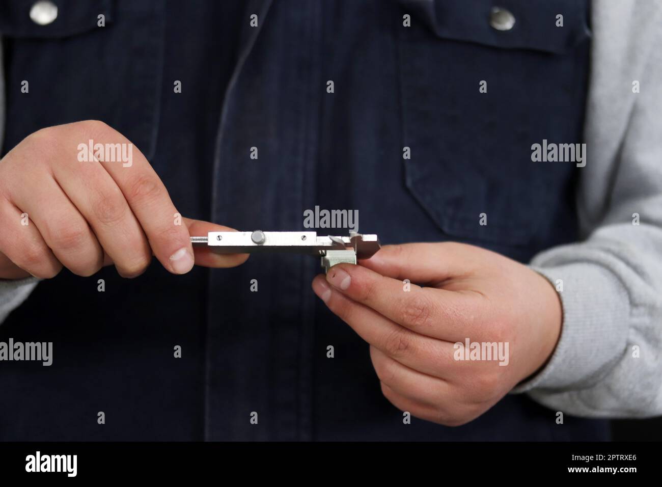 foreman working by hand and measuring metal with caliper tool Stock ...