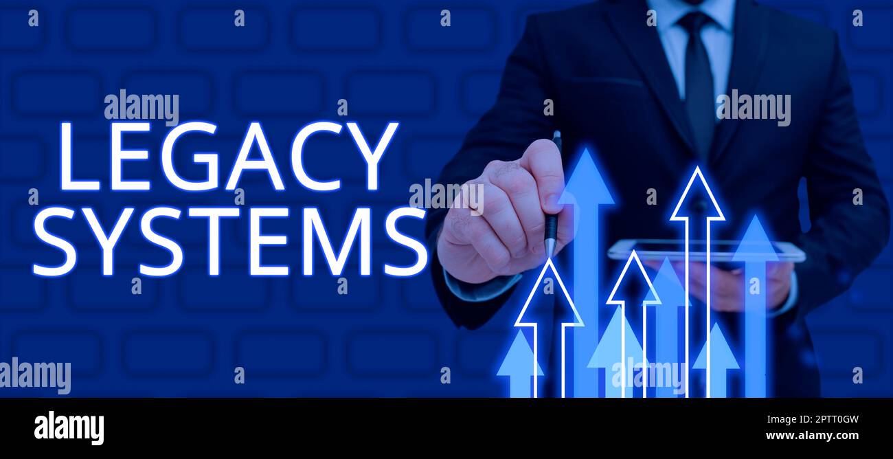 Hand writing sign Legacy Systems, Internet Concept old method ...