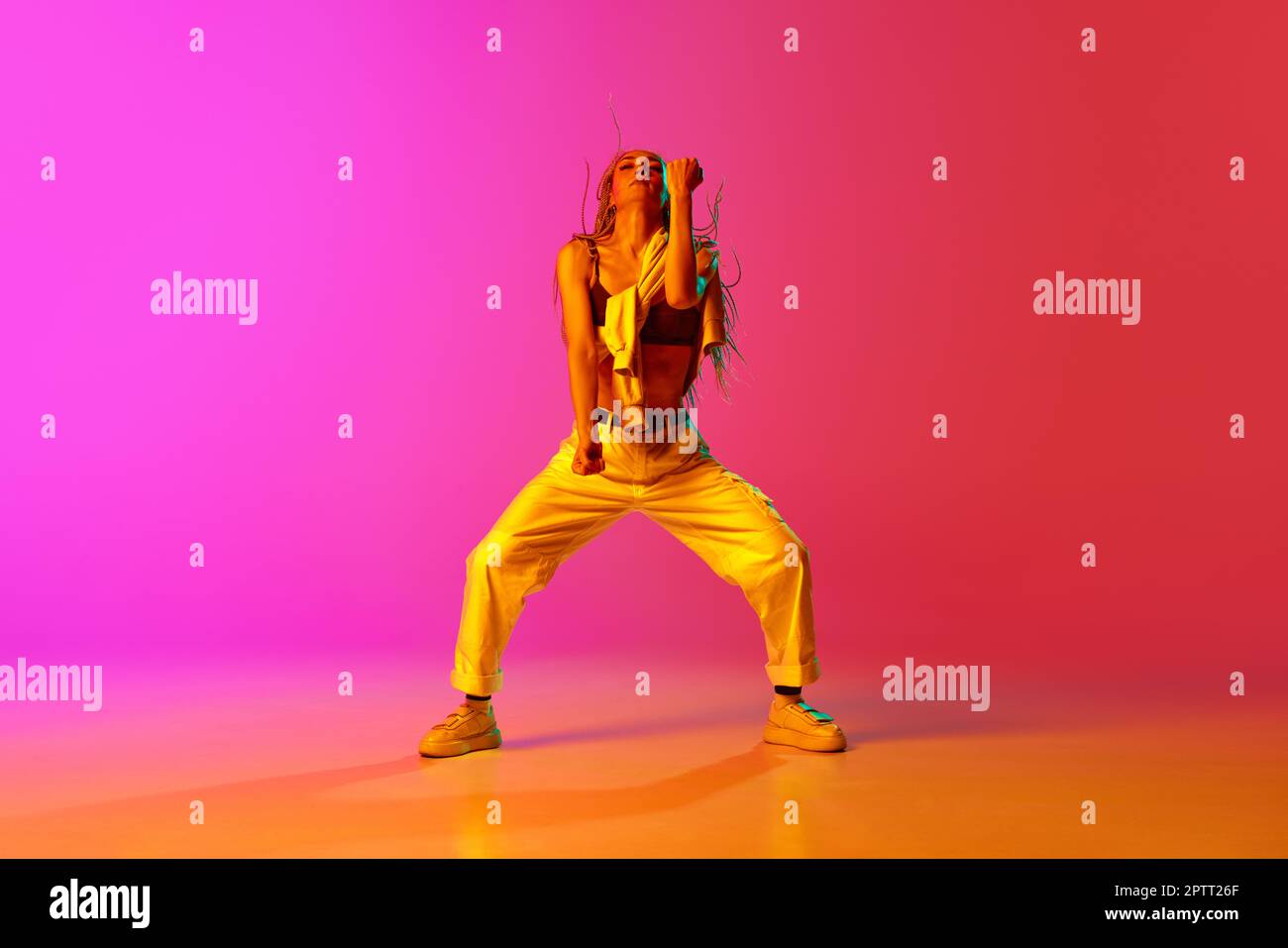 Portrait with one young girl, dancer with dreadlocks dancing over ...