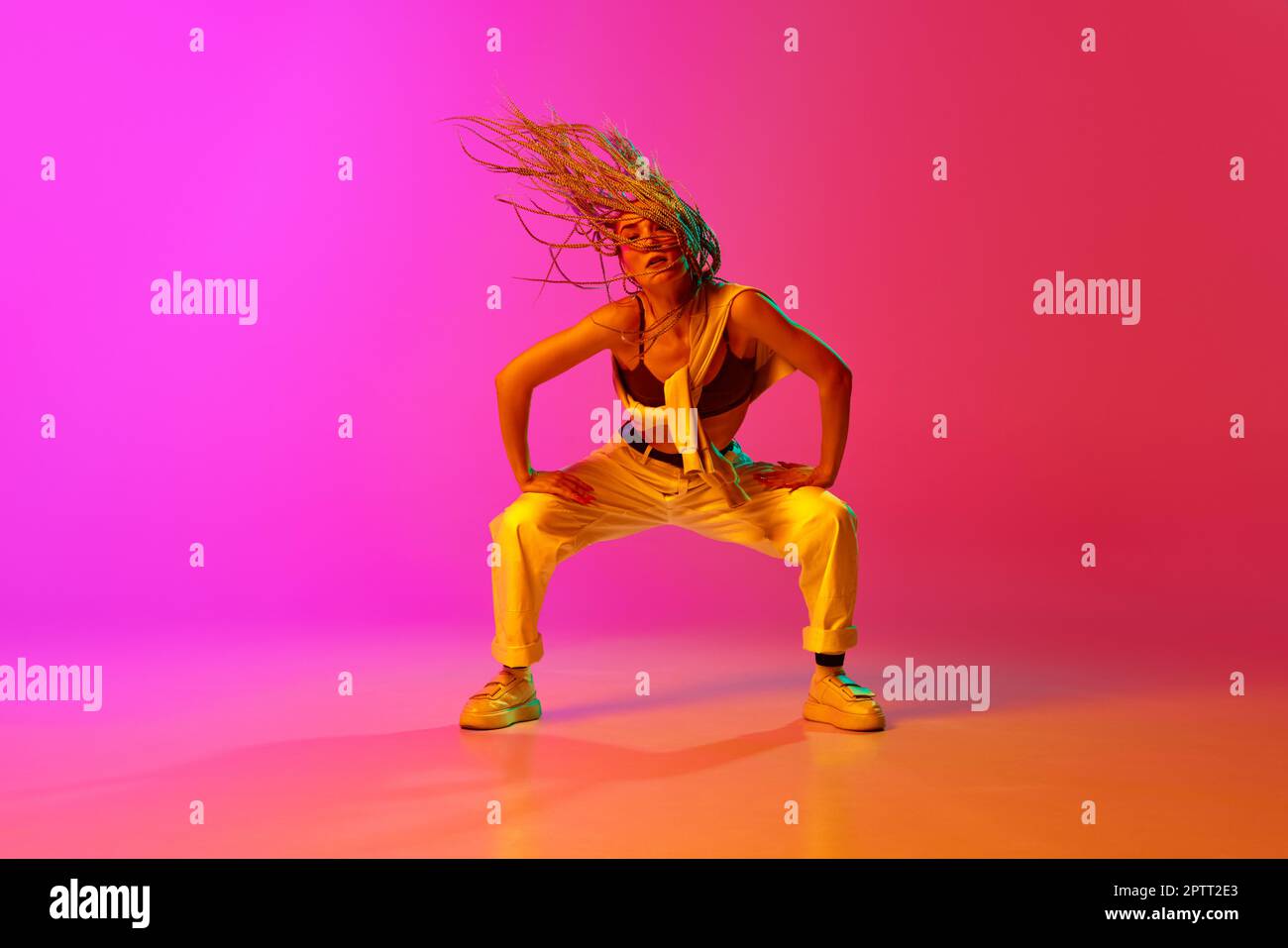 Portrait with professional dancer with dreadlocks wearing hip-hop ...