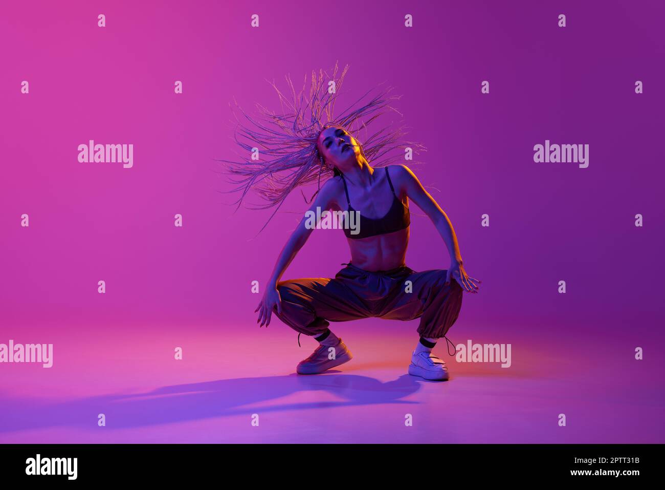 One young charming girl, professional dancer with flying hair wearing ...